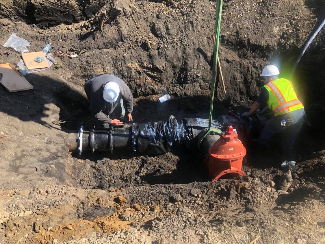 Cutting in a 12” Tap on a 12” Water Main - Curry & Sons Construction